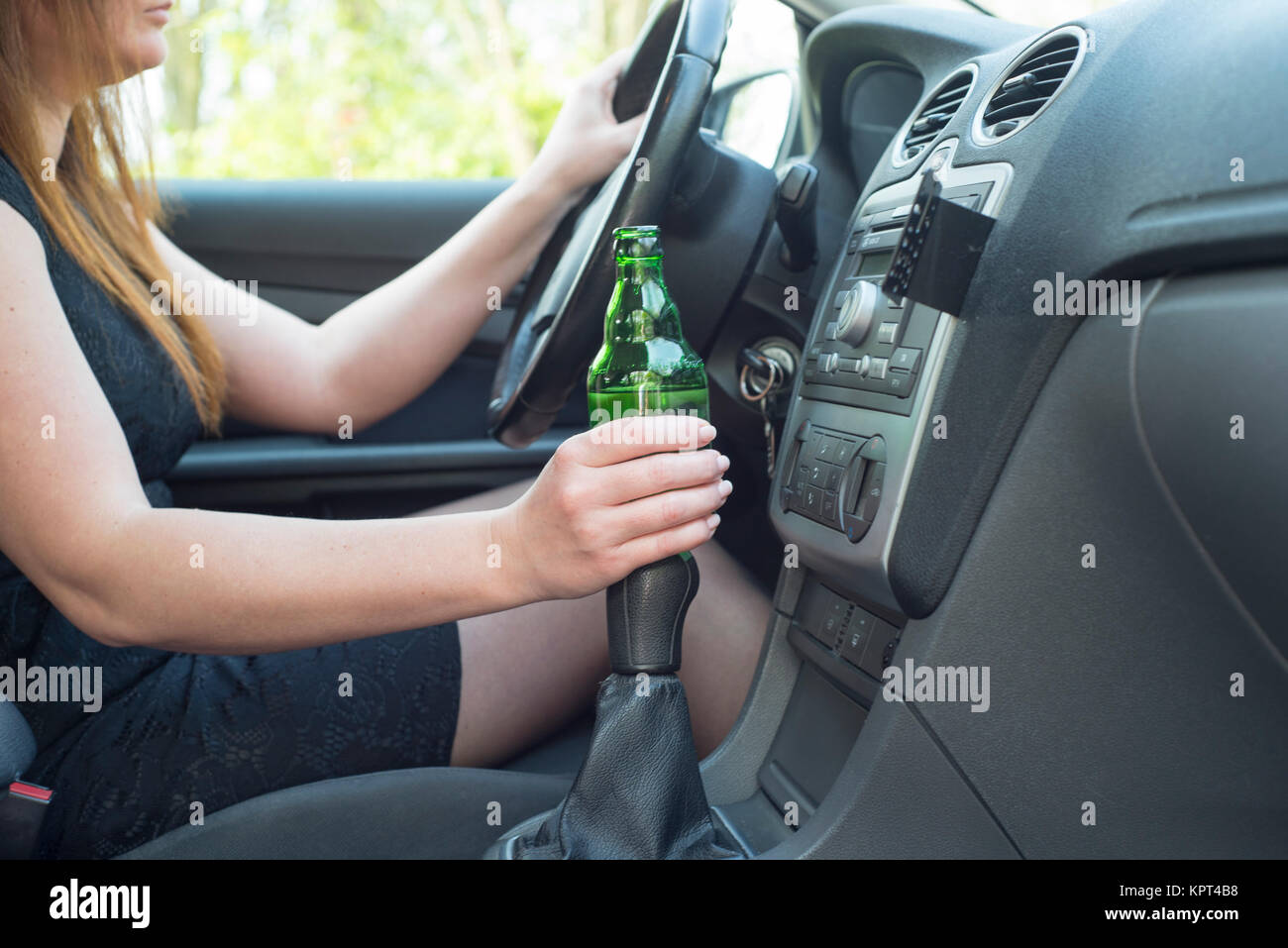 picture of woman drinking alcohol in the car Stock Photo - Alamy