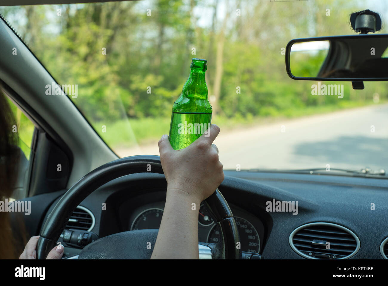 picture of woman drinking alcohol in the car Stock Photo - Alamy