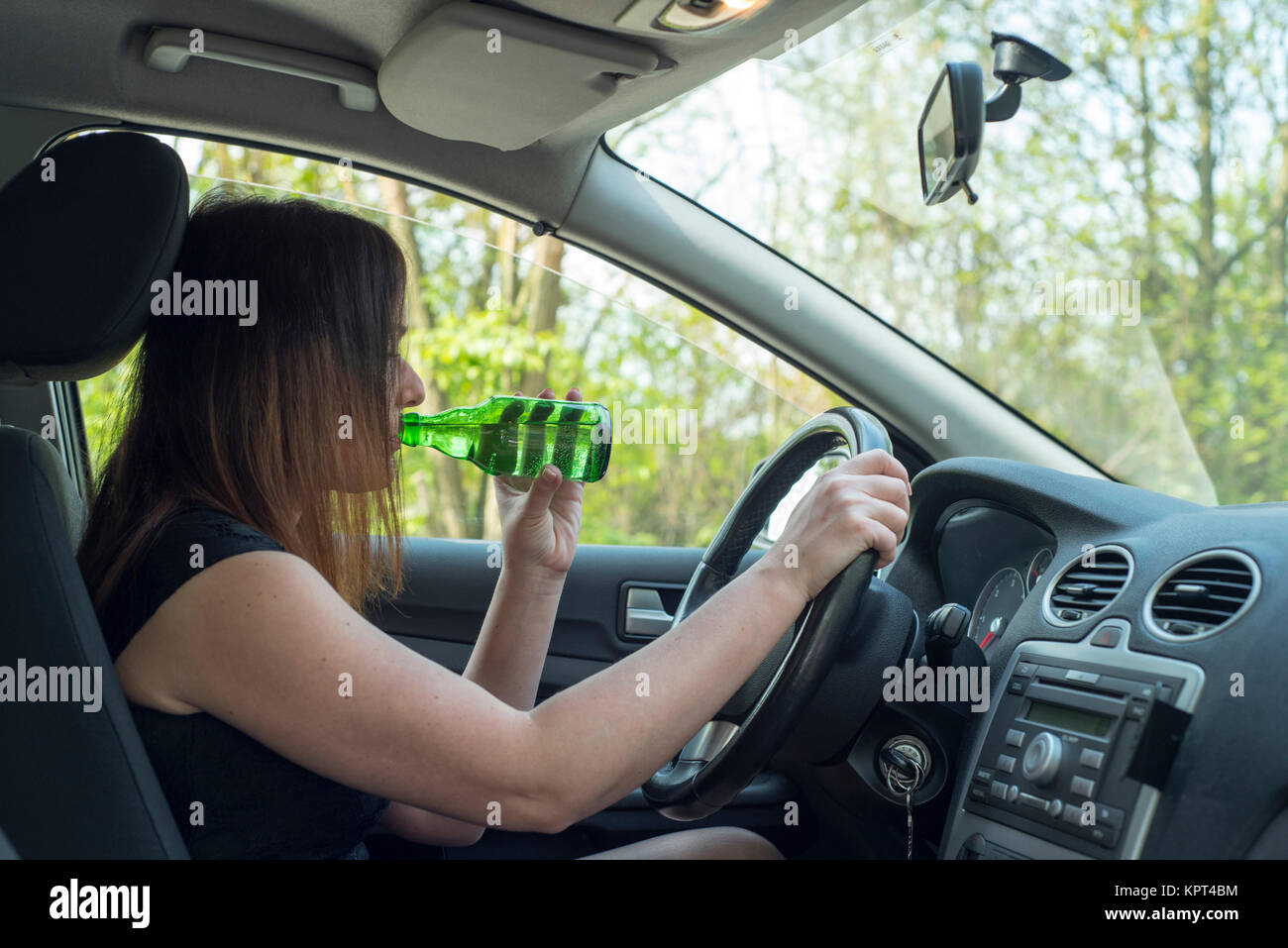 picture of woman drinking alcohol in the car Stock Photo - Alamy