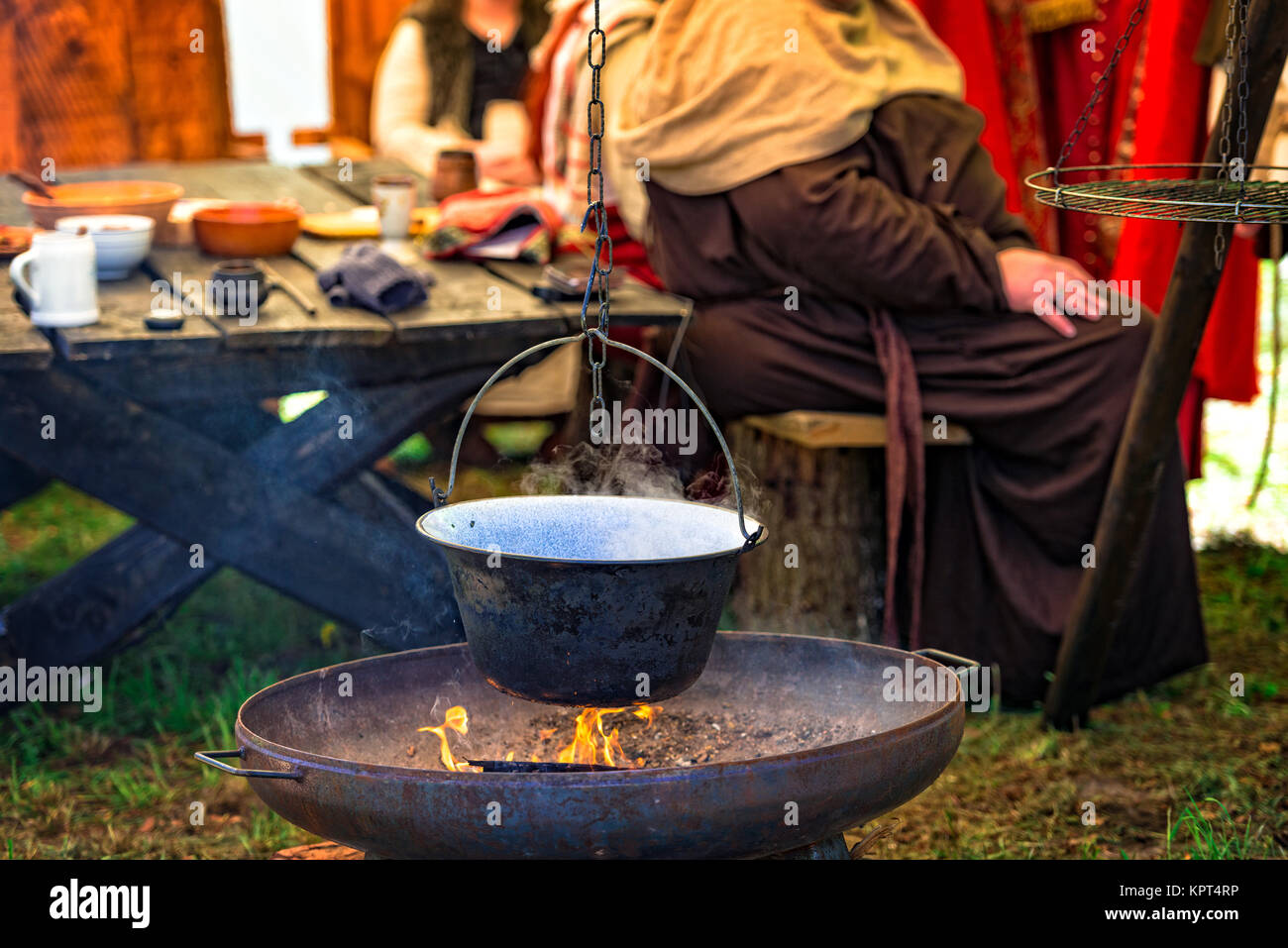 boiling over the fire Stock Photo - Alamy