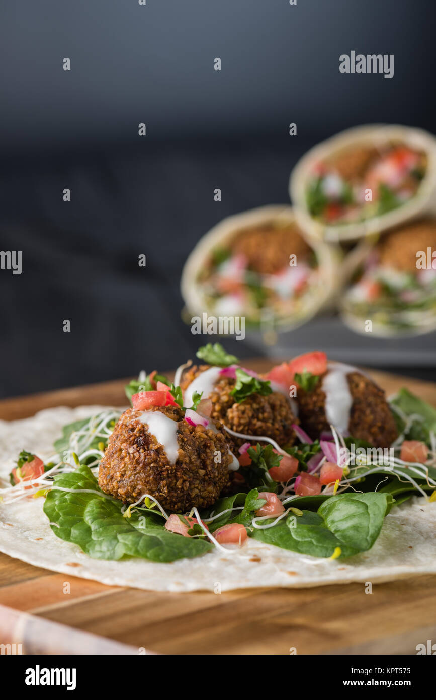 Vegan Falafel Wrap With Salsa and salad Stock Photo - Alamy