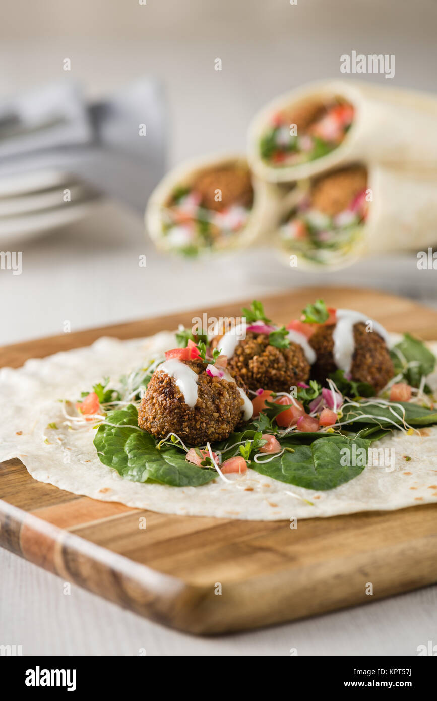 Vegan Falafel Wrap With Salsa and salad Stock Photo - Alamy