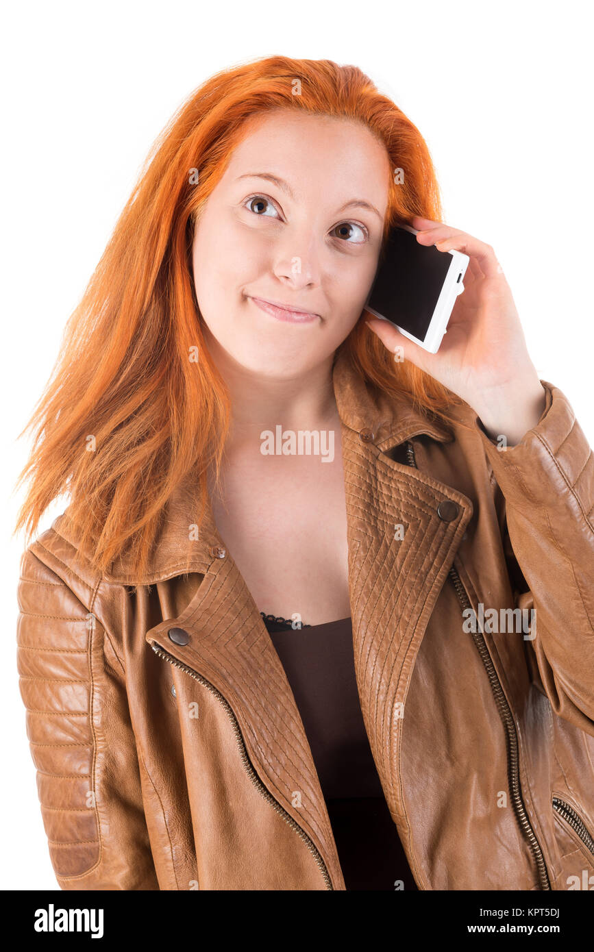 Beautiful red hair girl with cellphone isolated in white Stock Photo ...