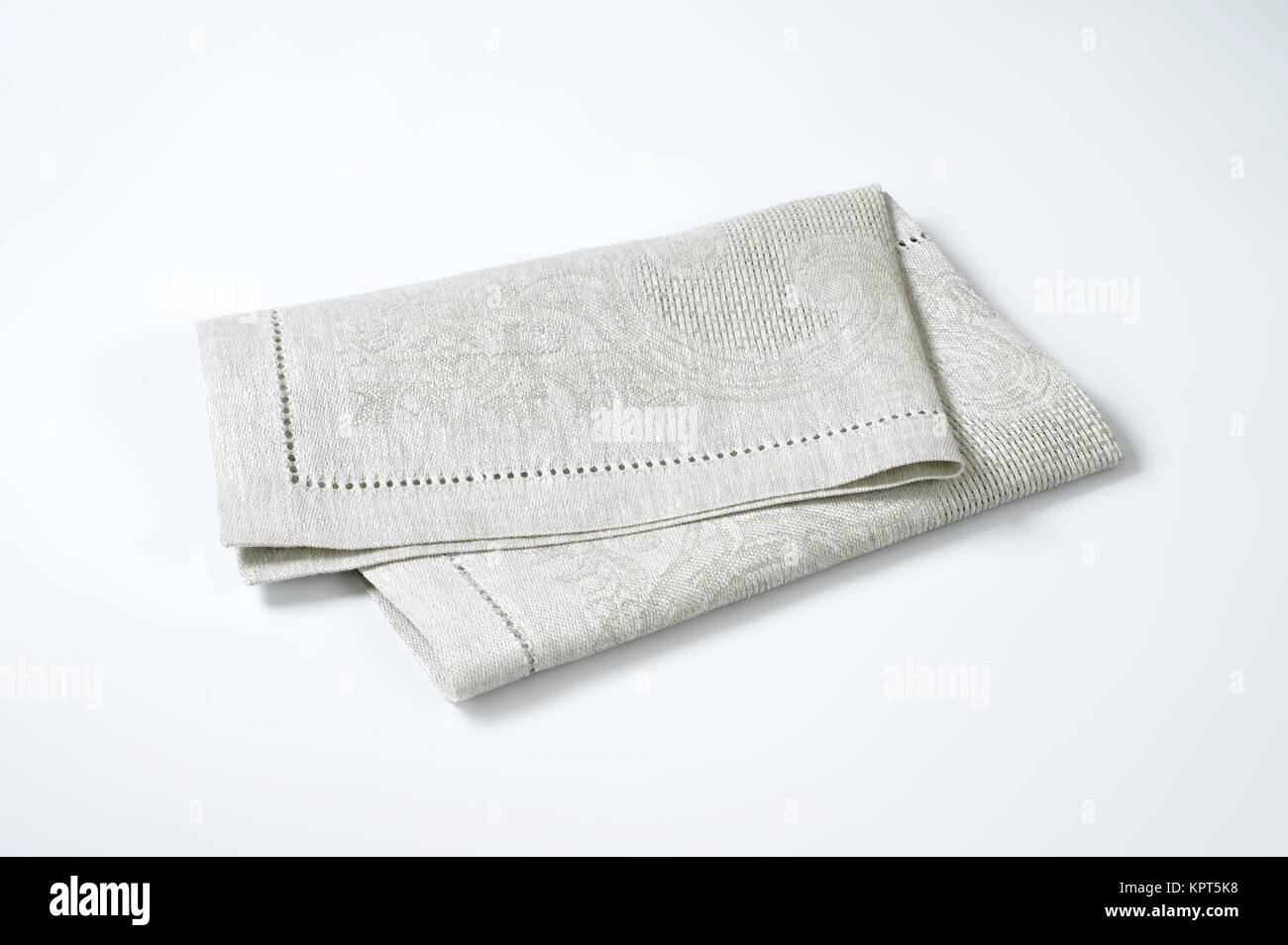 folded light grey cloth place mat Stock Photo - Alamy