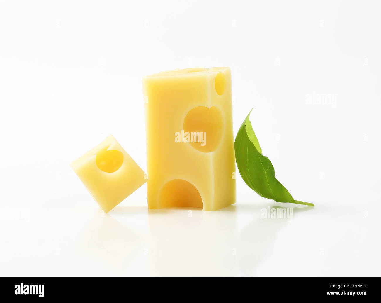 pieces of emmental cheese on white background Stock Photo - Alamy