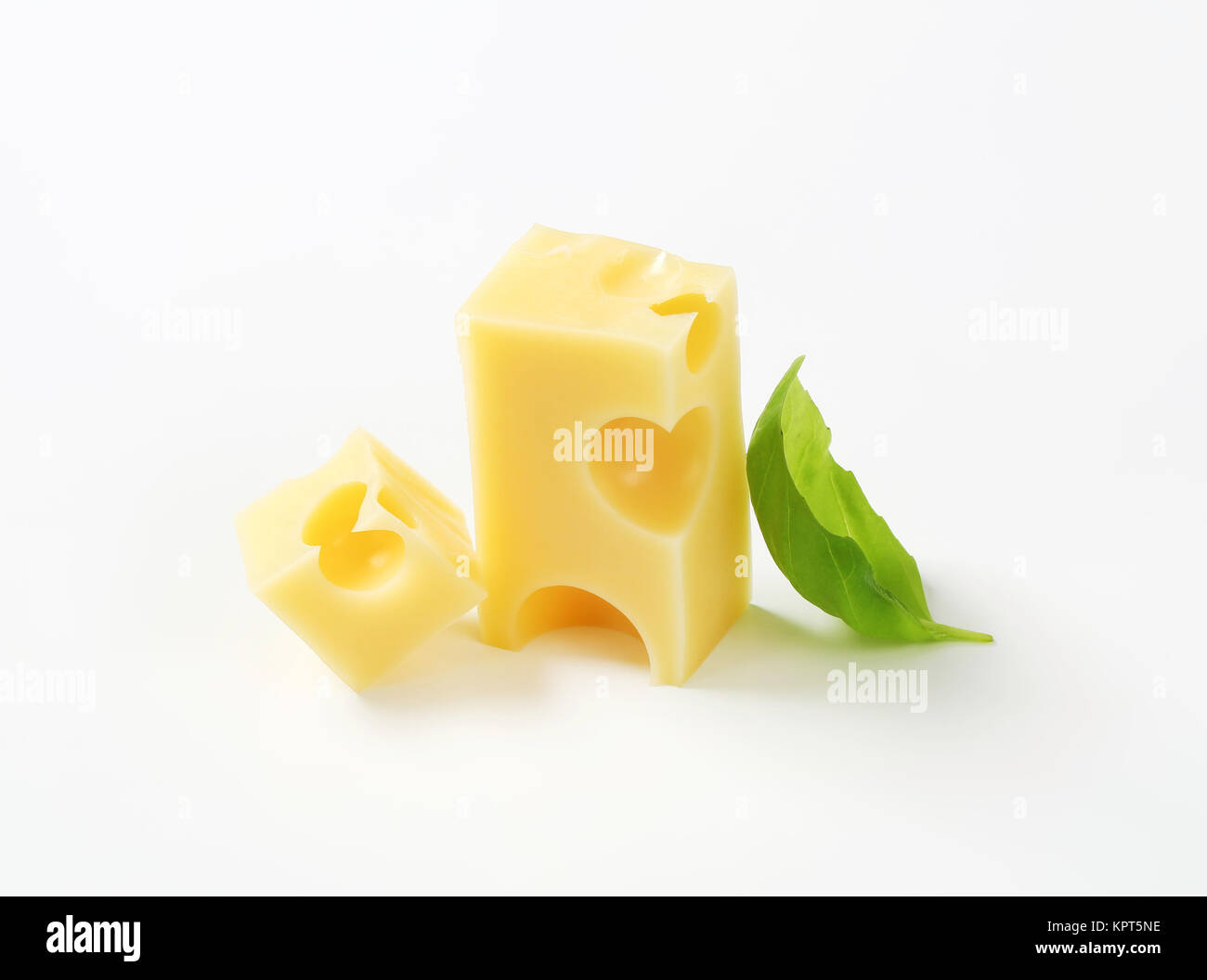 pieces of emmental cheese on white background Stock Photo - Alamy