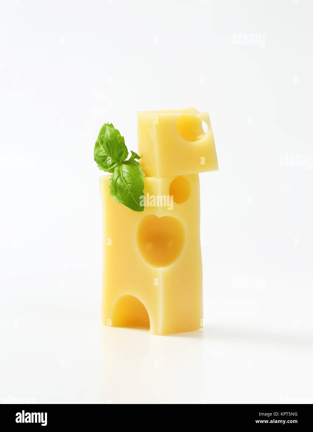 pieces of emmental cheese on white background Stock Photo - Alamy