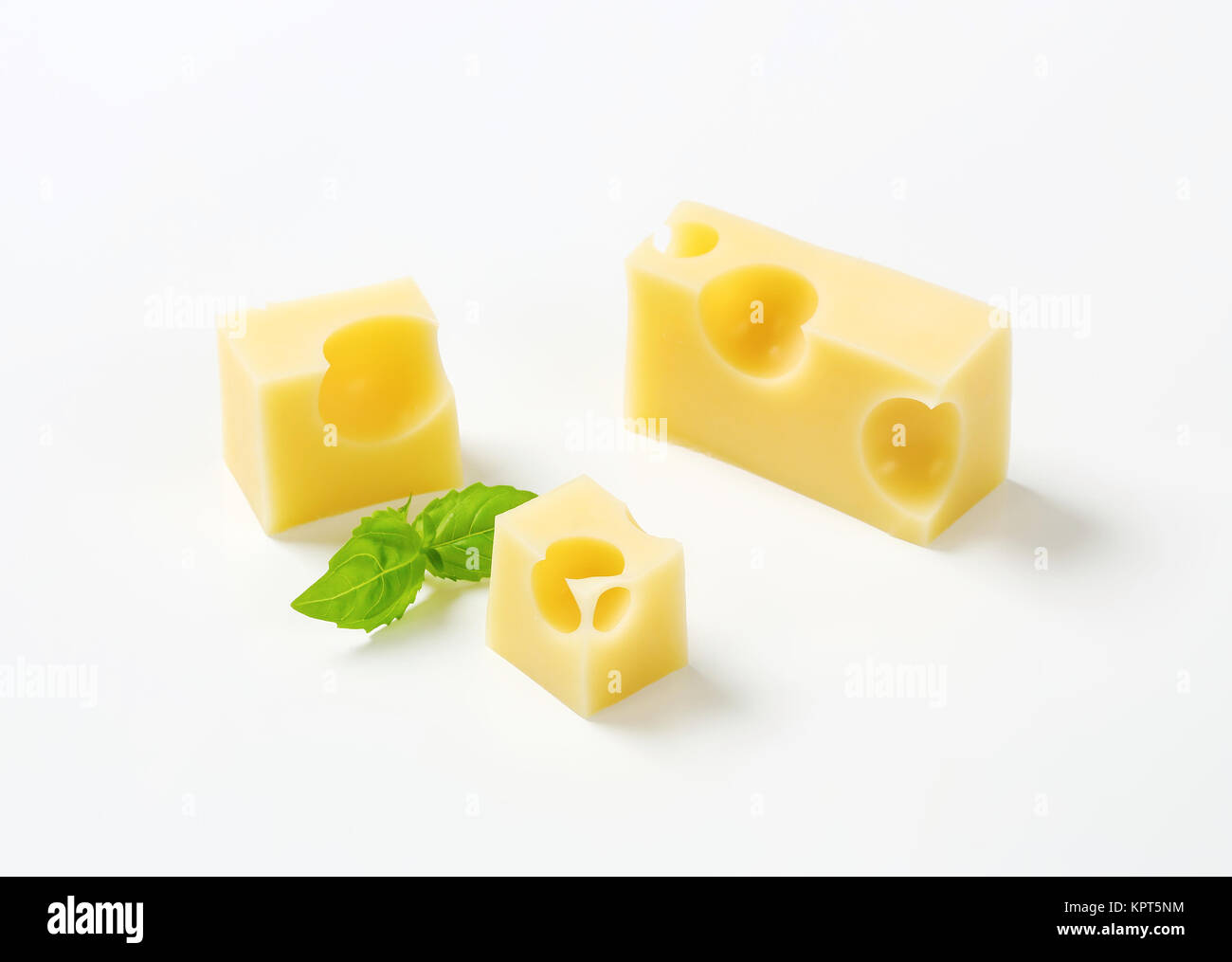 pieces of emmental cheese on white background Stock Photo - Alamy