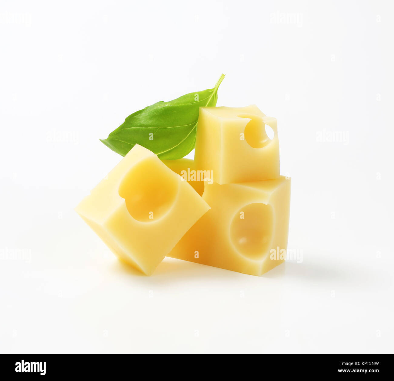 pieces of emmental cheese on white background Stock Photo - Alamy