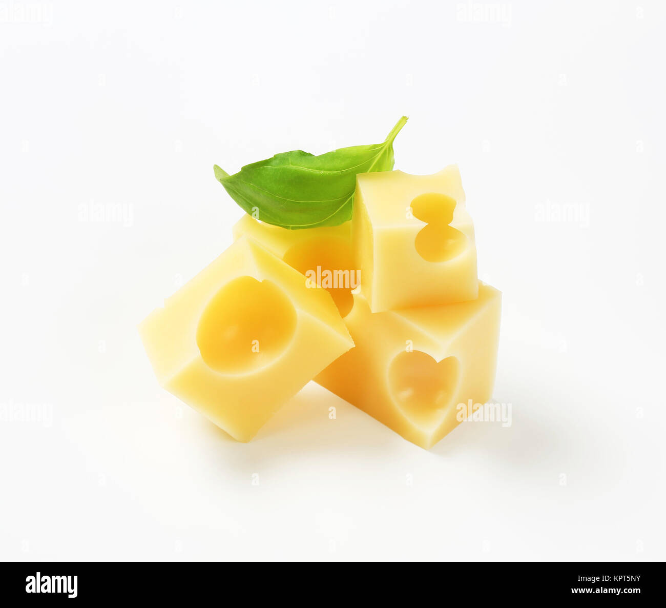 pieces of emmental cheese on white background Stock Photo - Alamy