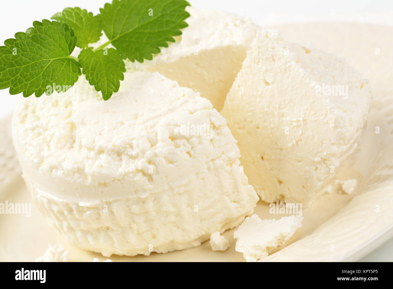 wheel of fresh curd cheese on plate Stock Photo - Alamy