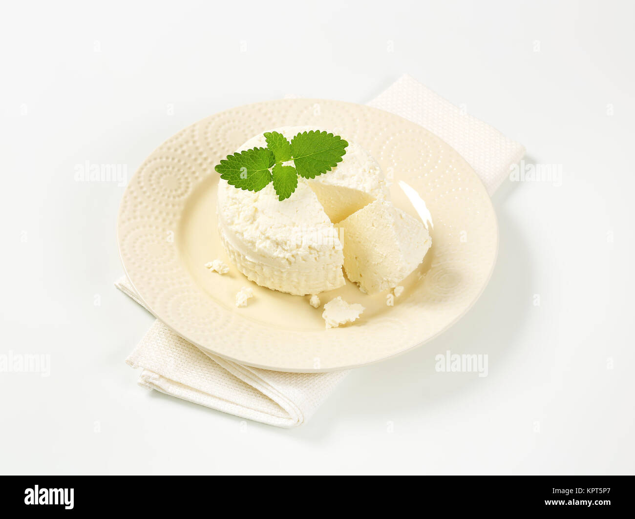 wheel of fresh curd cheese on plate Stock Photo - Alamy