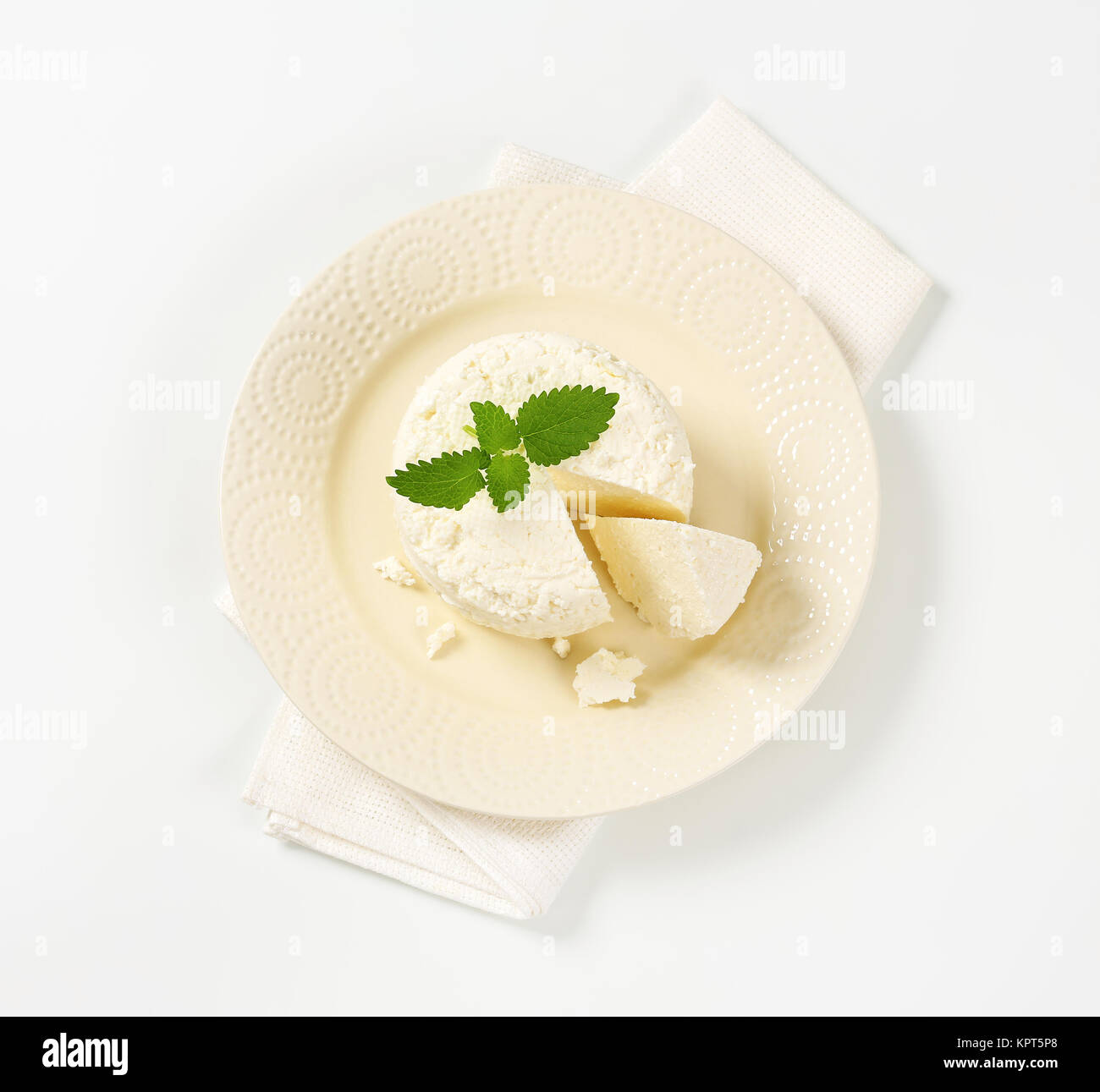 wheel of fresh curd cheese on plate Stock Photo - Alamy
