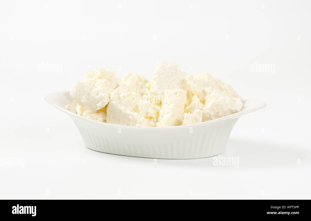 pieces of fresh curd cheese in white bowl Stock Photo - Alamy