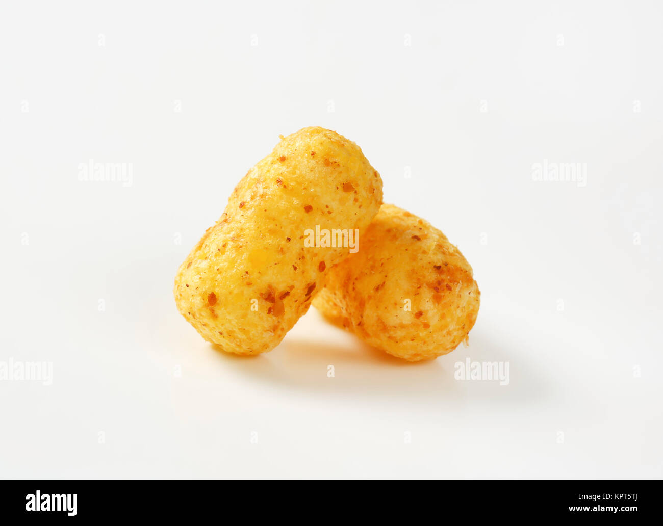 two peanut puffs on white background Stock Photo - Alamy
