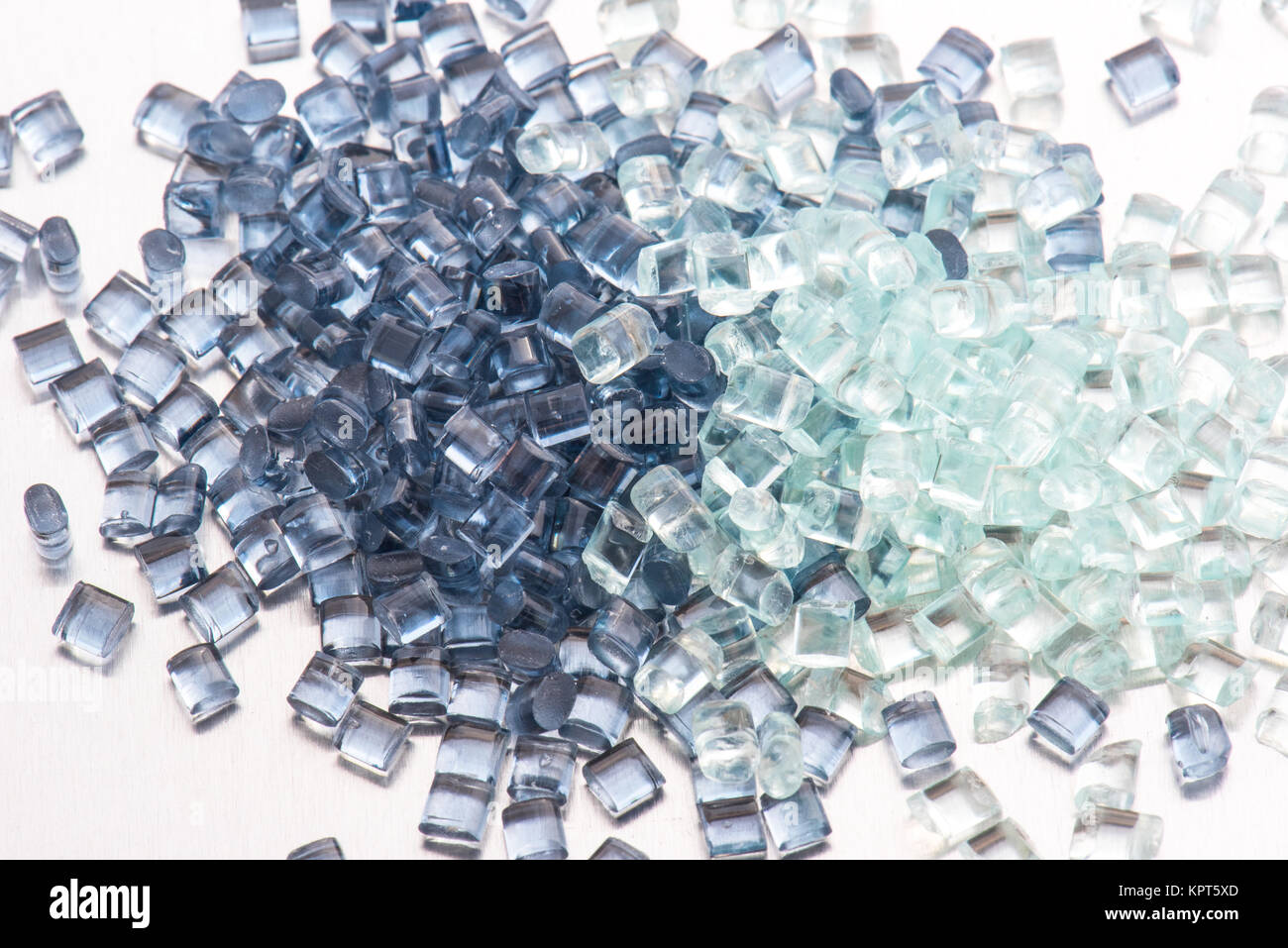 two different polymer plastic granulates on white background Stock ...