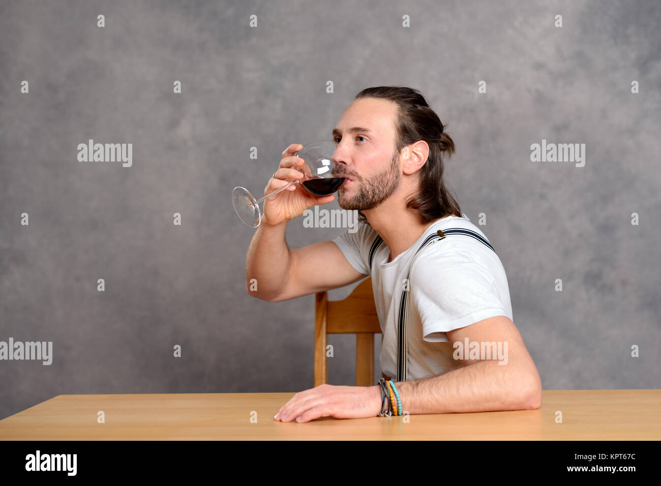 young man drinking red wine Stock Photo - Alamy