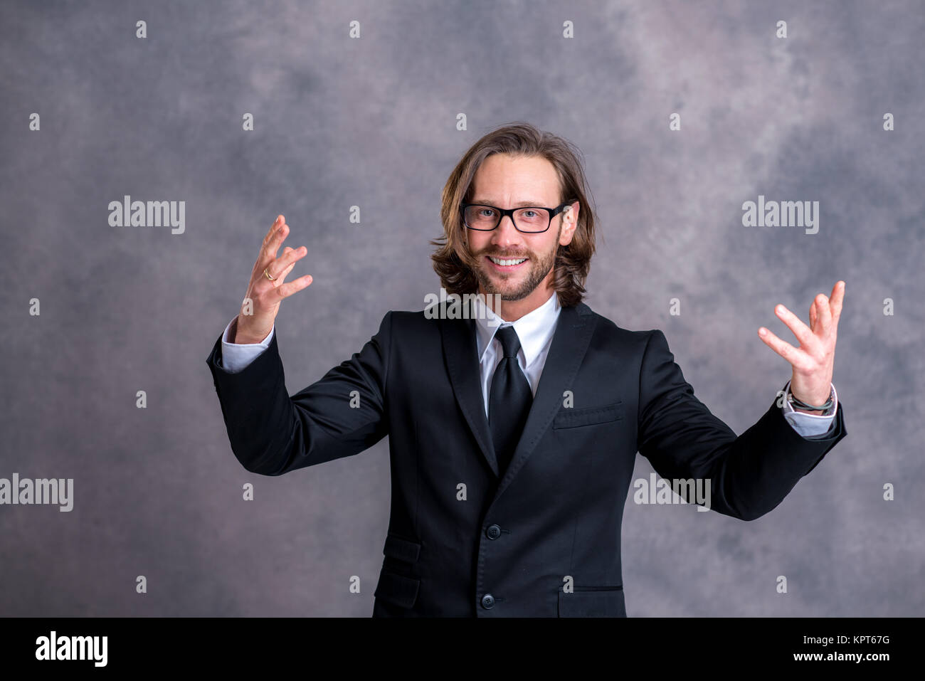 young laughing businessman in black suit Stock Photo - Alamy