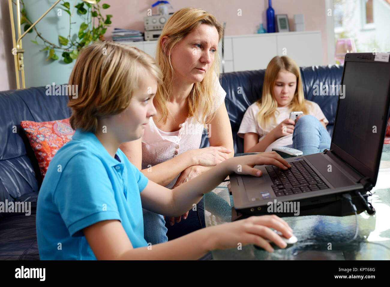 mother and her children using computer Stock Photo - Alamy