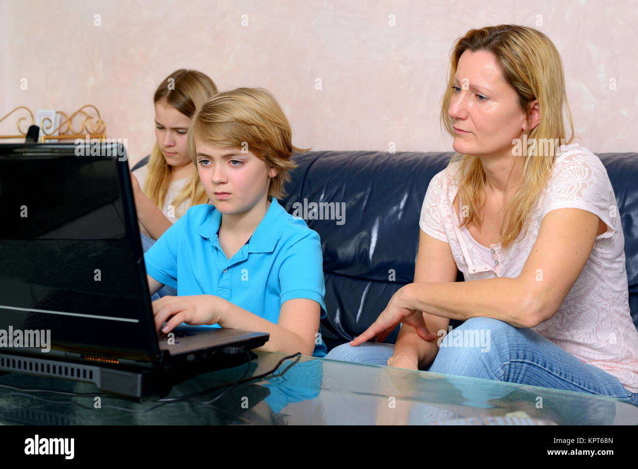 mother and her children using computer Stock Photo - Alamy