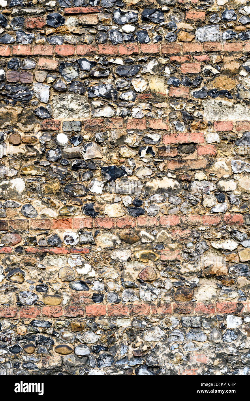 Flint stone wall texture from the aged exterior of a church building ...