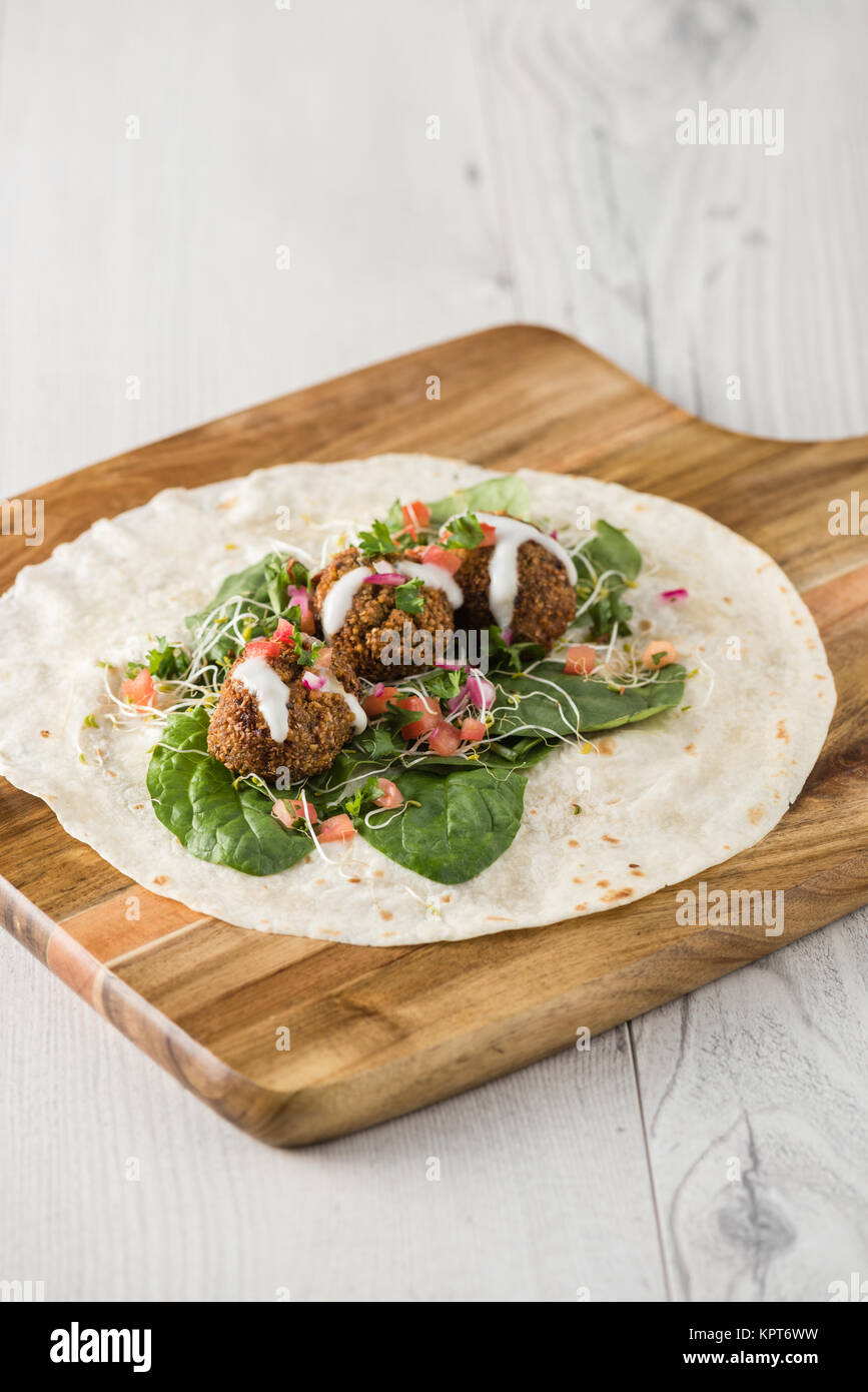 Vegan Falafel Wrap With Salsa and salad Stock Photo - Alamy