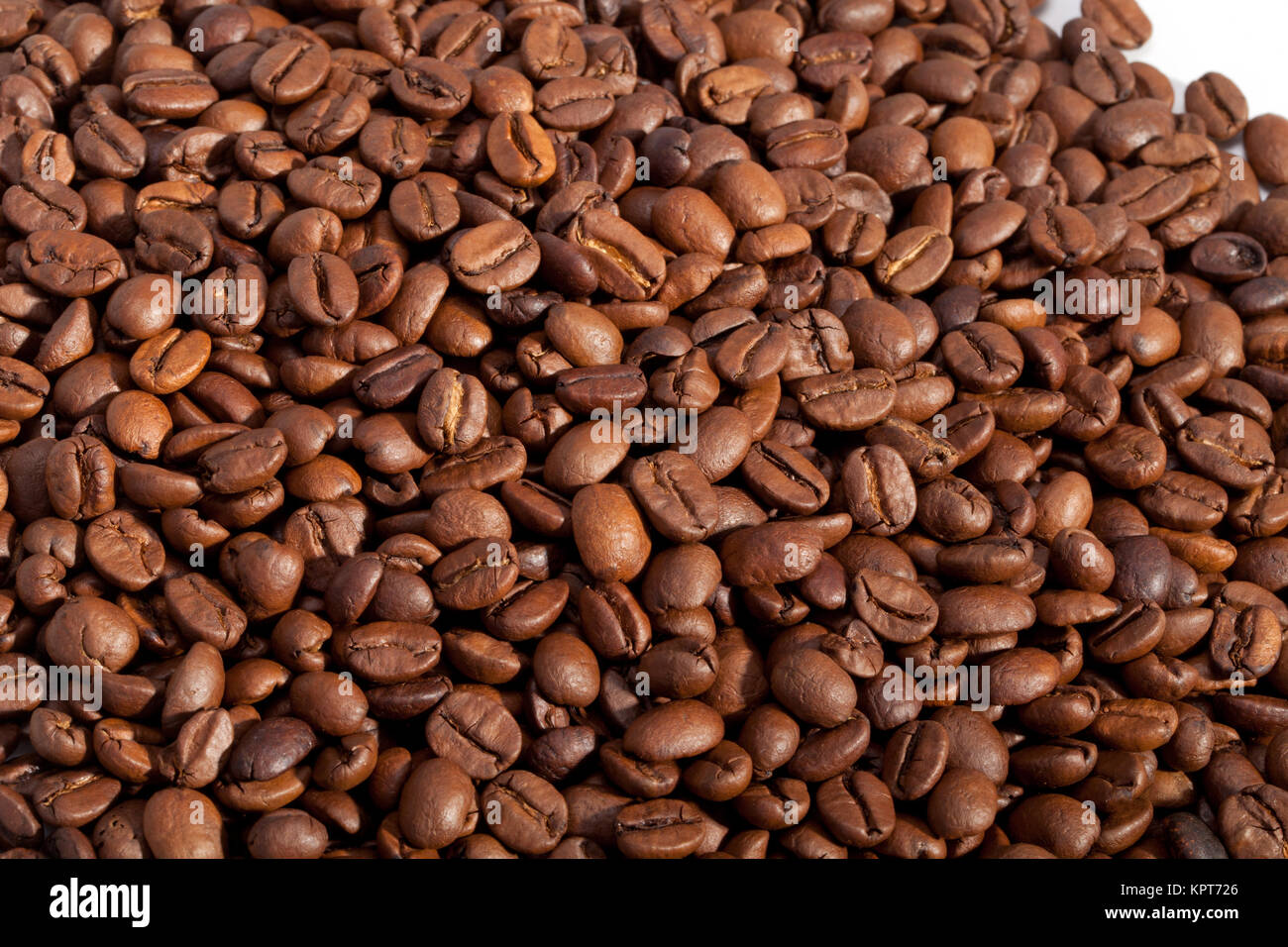 coffee beans close up isolated on white Stock Photo - Alamy