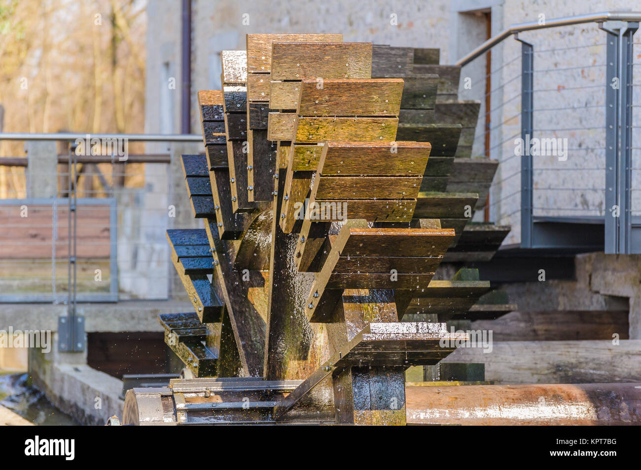 Series of three wheeled wooden mill renovated Stock Photo - Alamy