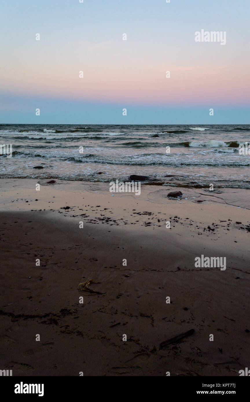 frozen beach in cold winters day with colorful sky and ice Stock Photo ...