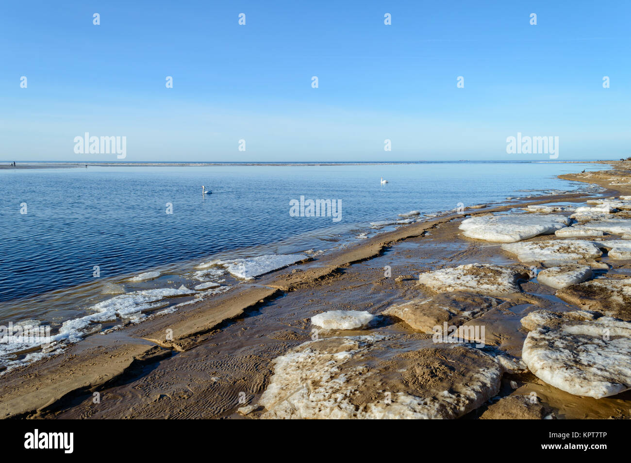 frozen beach in cold winters day with colorful sky and ice Stock Photo ...