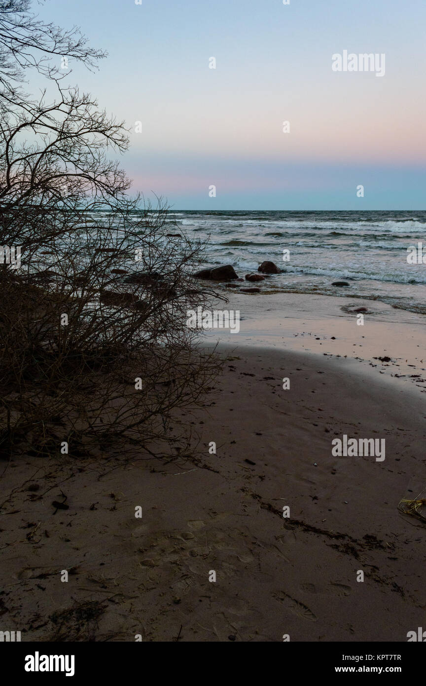 frozen beach in cold winters day with colorful sky and ice Stock Photo ...