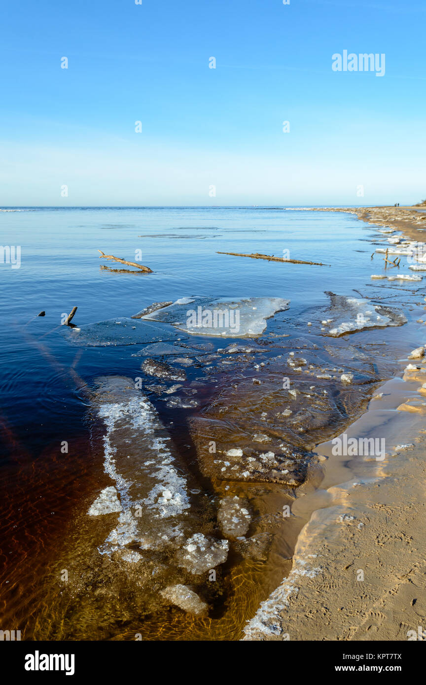 frozen beach in cold winters day with colorful sky and ice Stock Photo ...