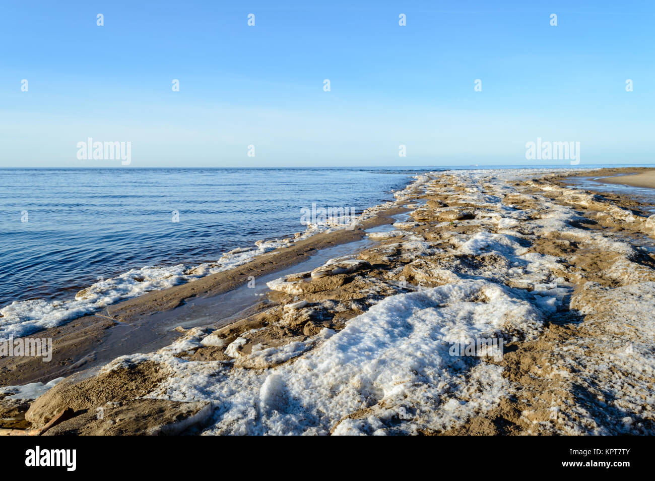 frozen beach in cold winters day with colorful sky and ice Stock Photo ...