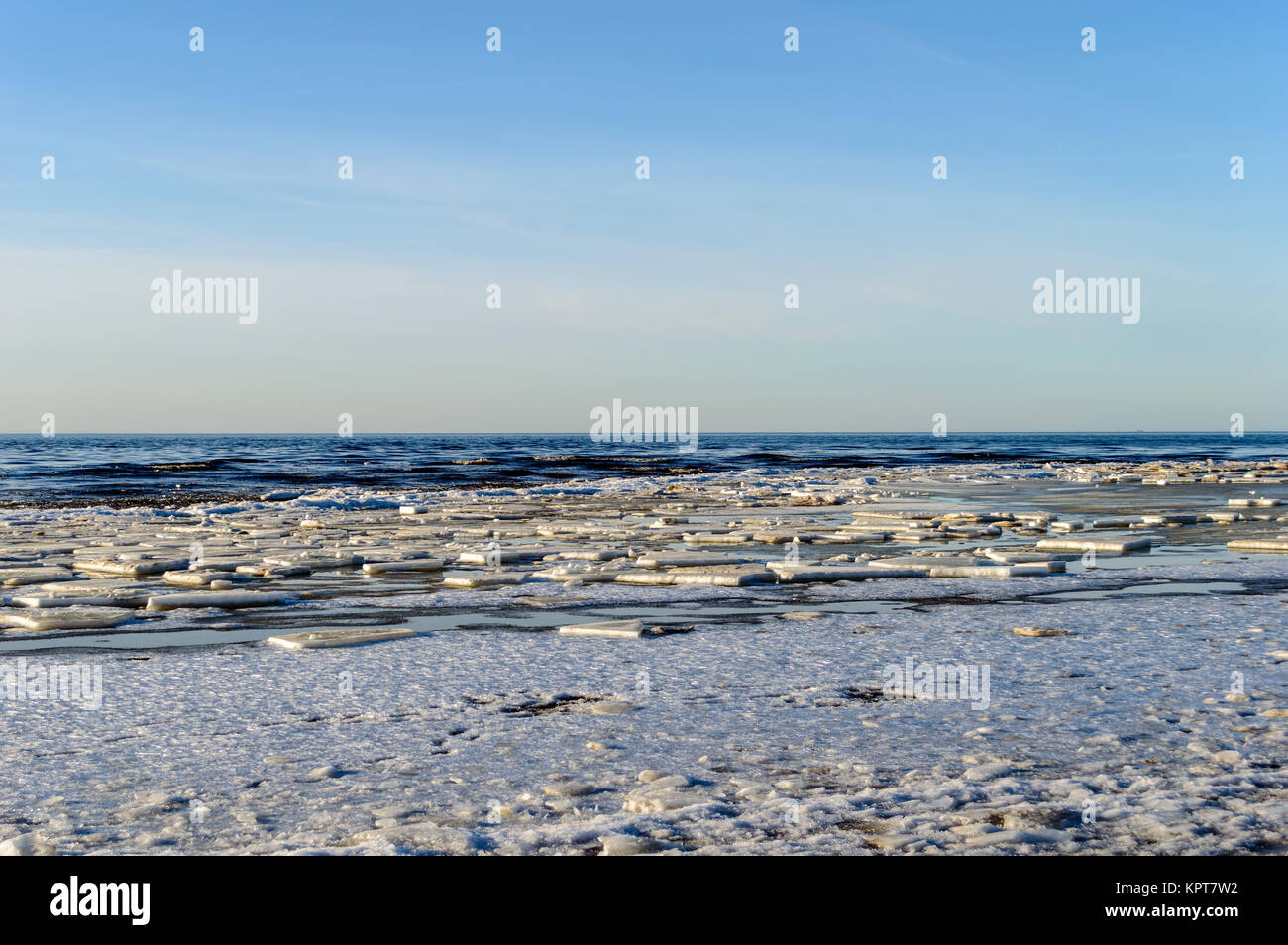 frozen beach in cold winters day with colorful sky and ice Stock Photo ...