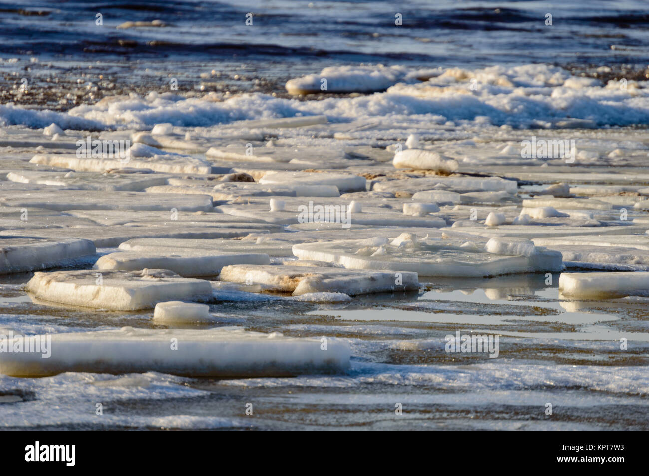 frozen beach in cold winters day with colorful sky and ice Stock Photo ...