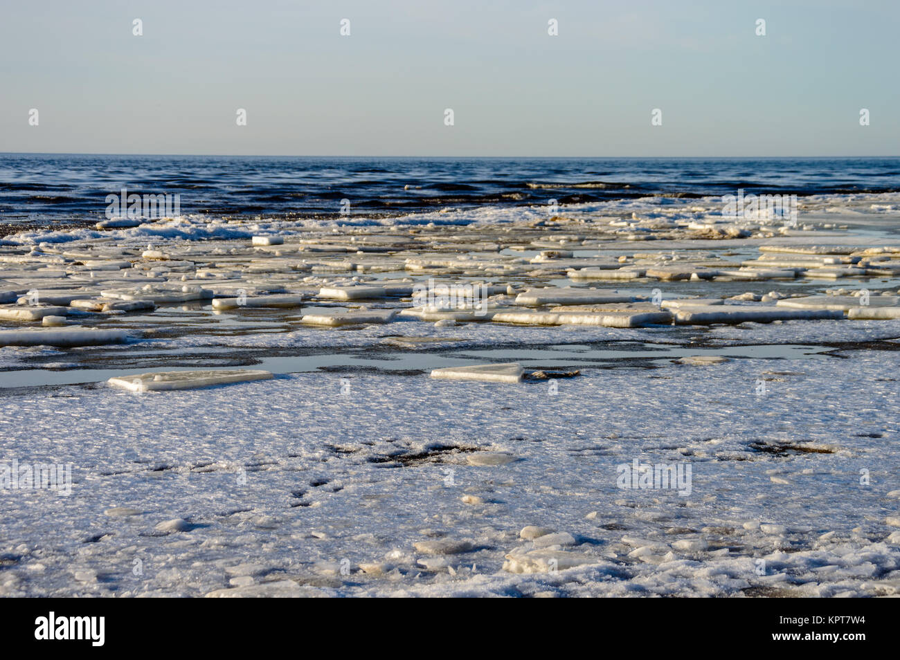 frozen beach in cold winters day with colorful sky and ice Stock Photo ...