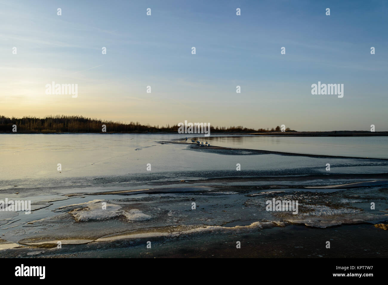frozen beach in cold winters day with colorful sky and ice Stock Photo ...
