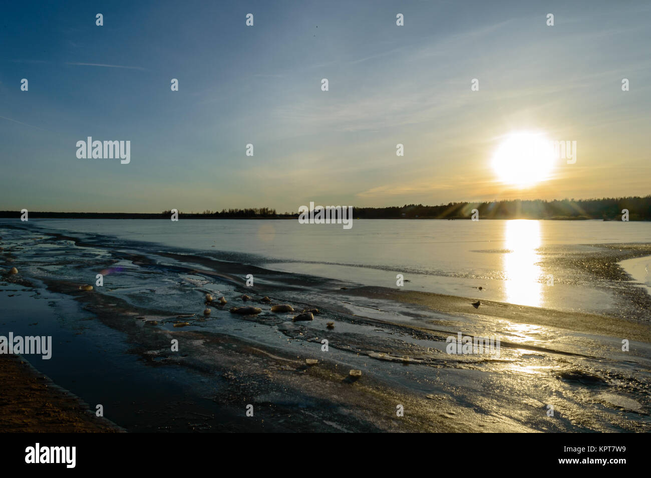 frozen beach in cold winters day with colorful sky and ice Stock Photo ...