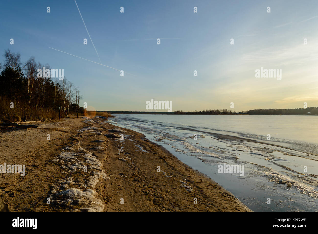 frozen beach in cold winters day with colorful sky and ice Stock Photo ...