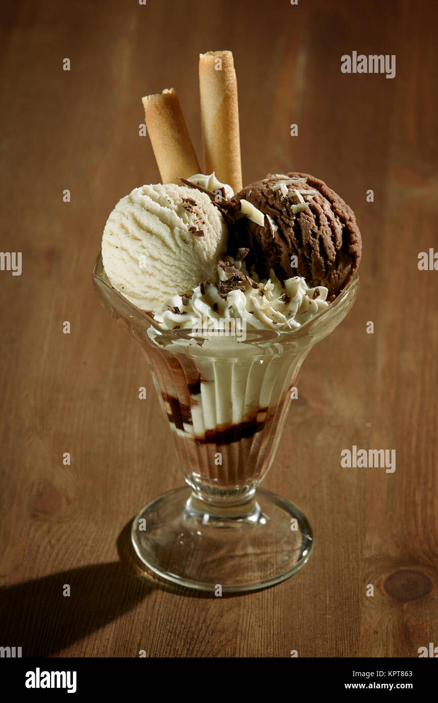 Frozen chocolate and vanilla sundae ice cream dessert served in a tall ...