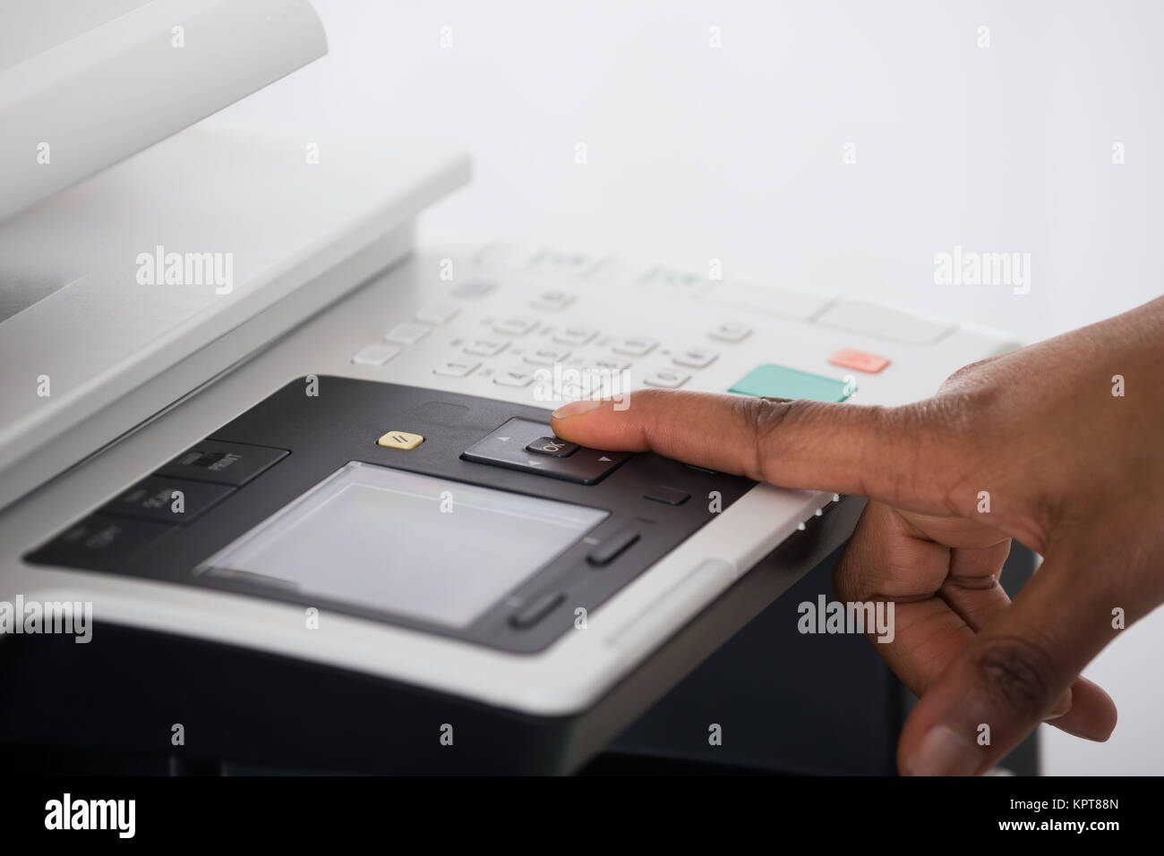 Businesswoman Pressing Printer's Button Stock Photo - Alamy