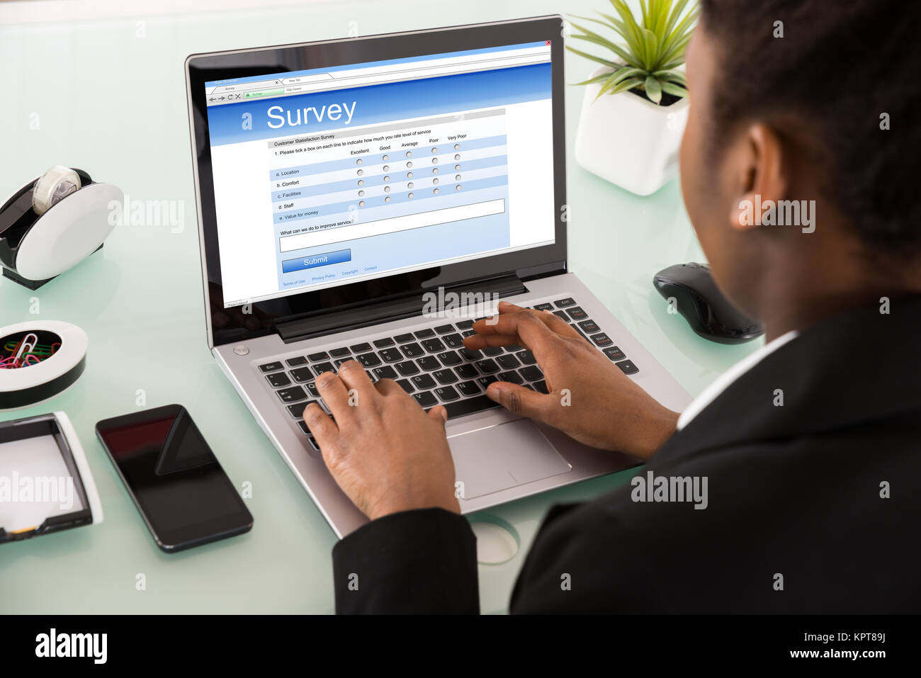 Close-up Of A Businesswoman Filling Online Survey Form Stock Photo - Alamy