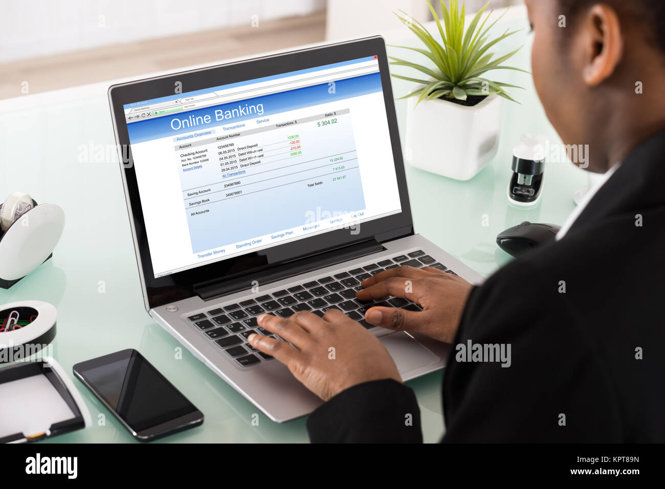 Businesswoman Using Online Banking Service On Laptop Stock Photo - Alamy