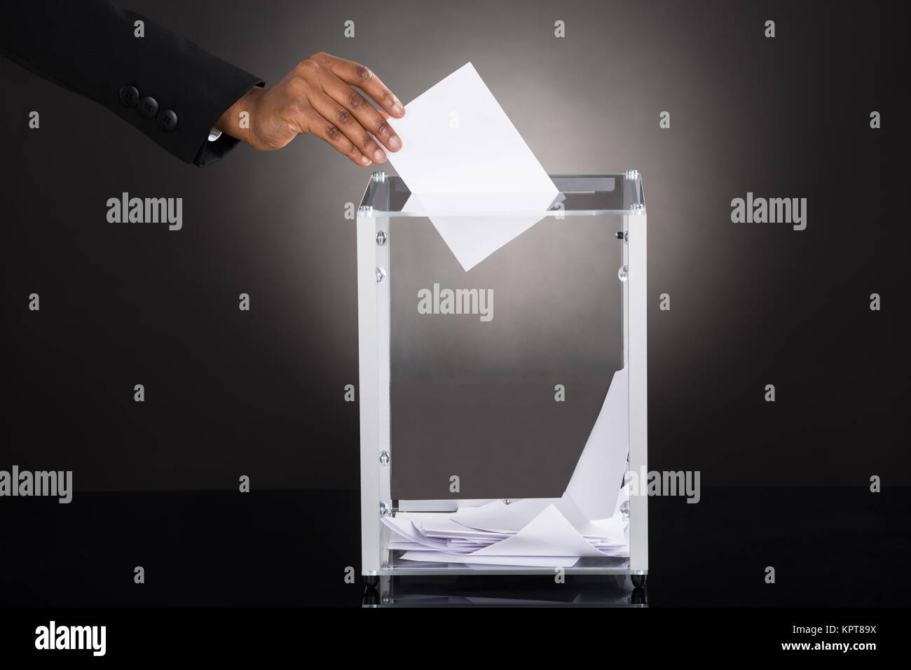Businessperson Hand Inserting Ballot In Box Stock Photo - Alamy Businessperson Hand Inserting Ballot In Box Stock Photo - Alamy