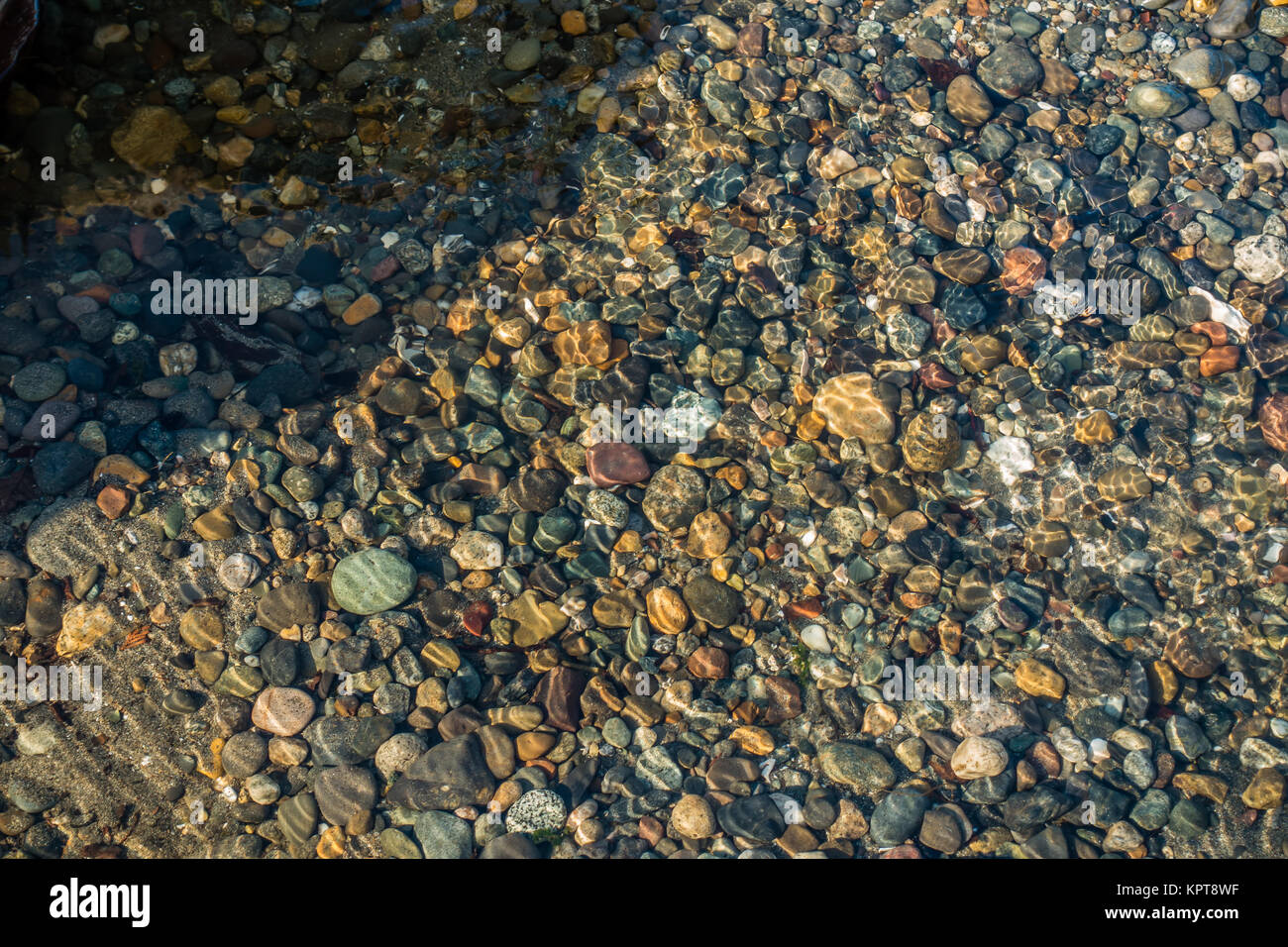 A view of pebbles on the shore at Seahurst Park in Burien, Washington ...