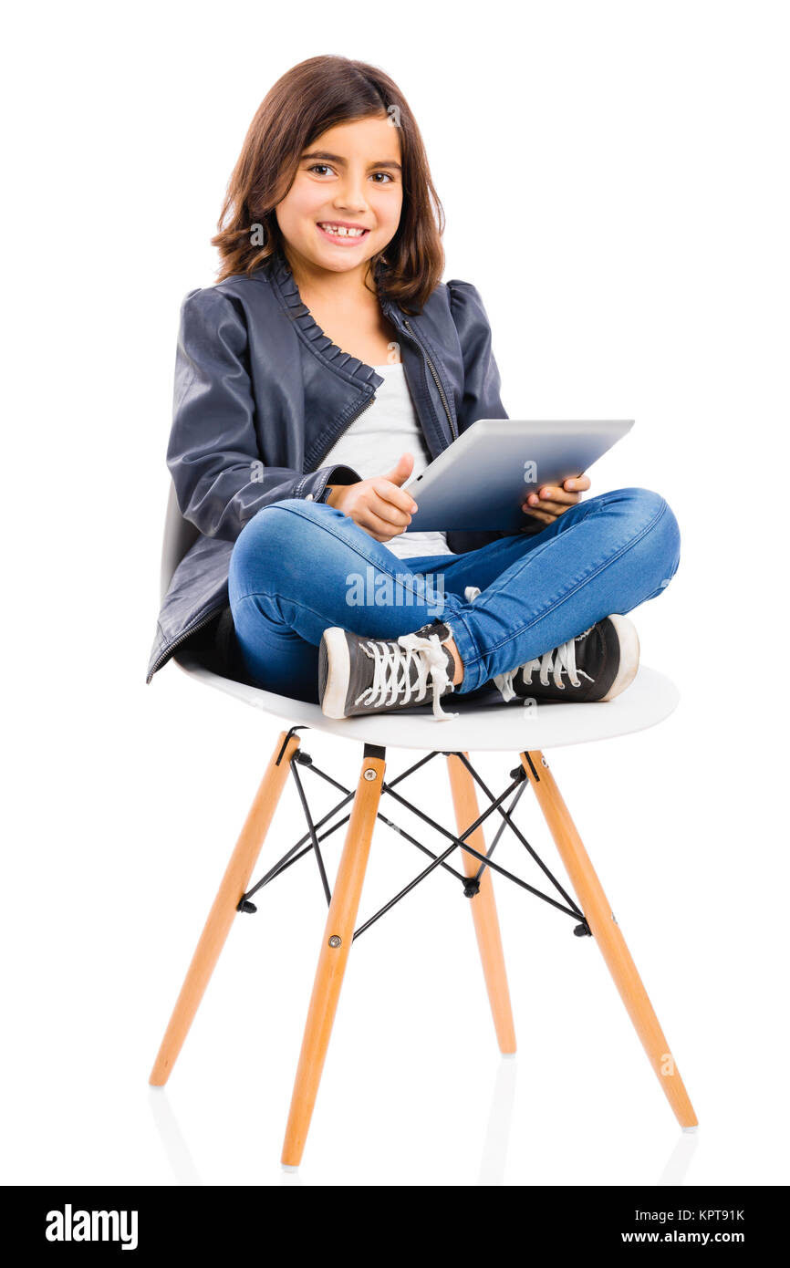 Young girl using a tablet Stock Photo - Alamy