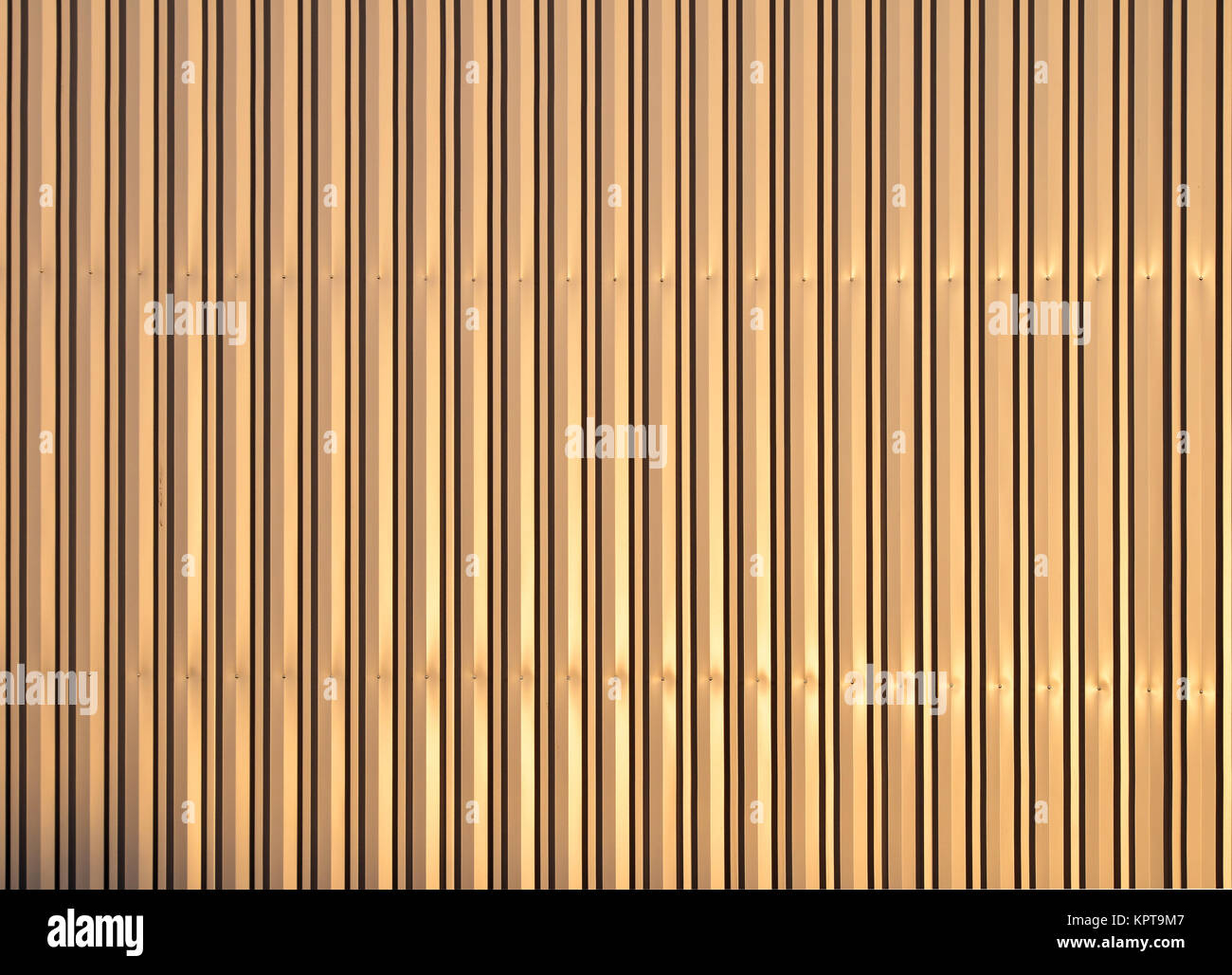 Aluminum golden corrugated metal wall Stock Photo - Alamy