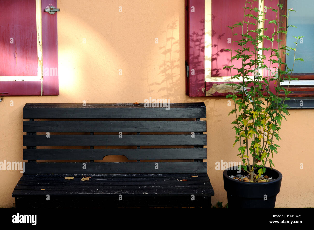 wooden bench in front of a house Stock Photo - Alamy