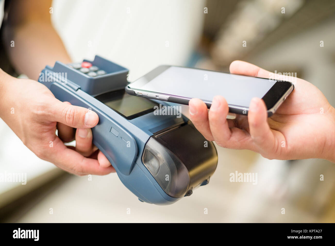 woman pay by cellphone Stock Photo - Alamy