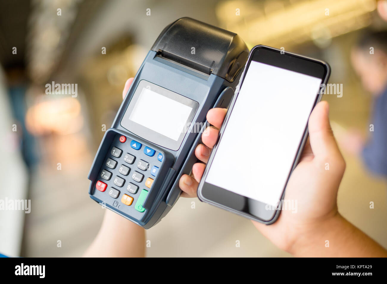 Customer pay with mobile phone Stock Photo - Alamy